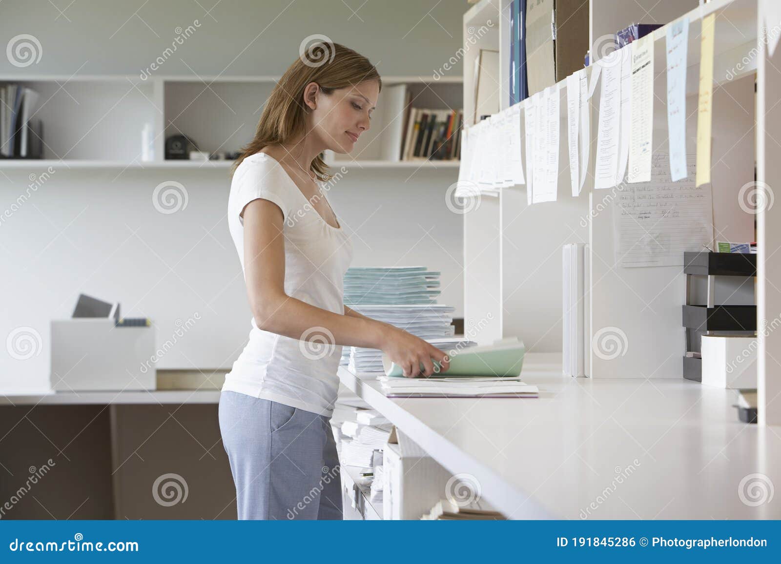 Office Worker Holding Sorting Paper Materials Standing in Office Side ...