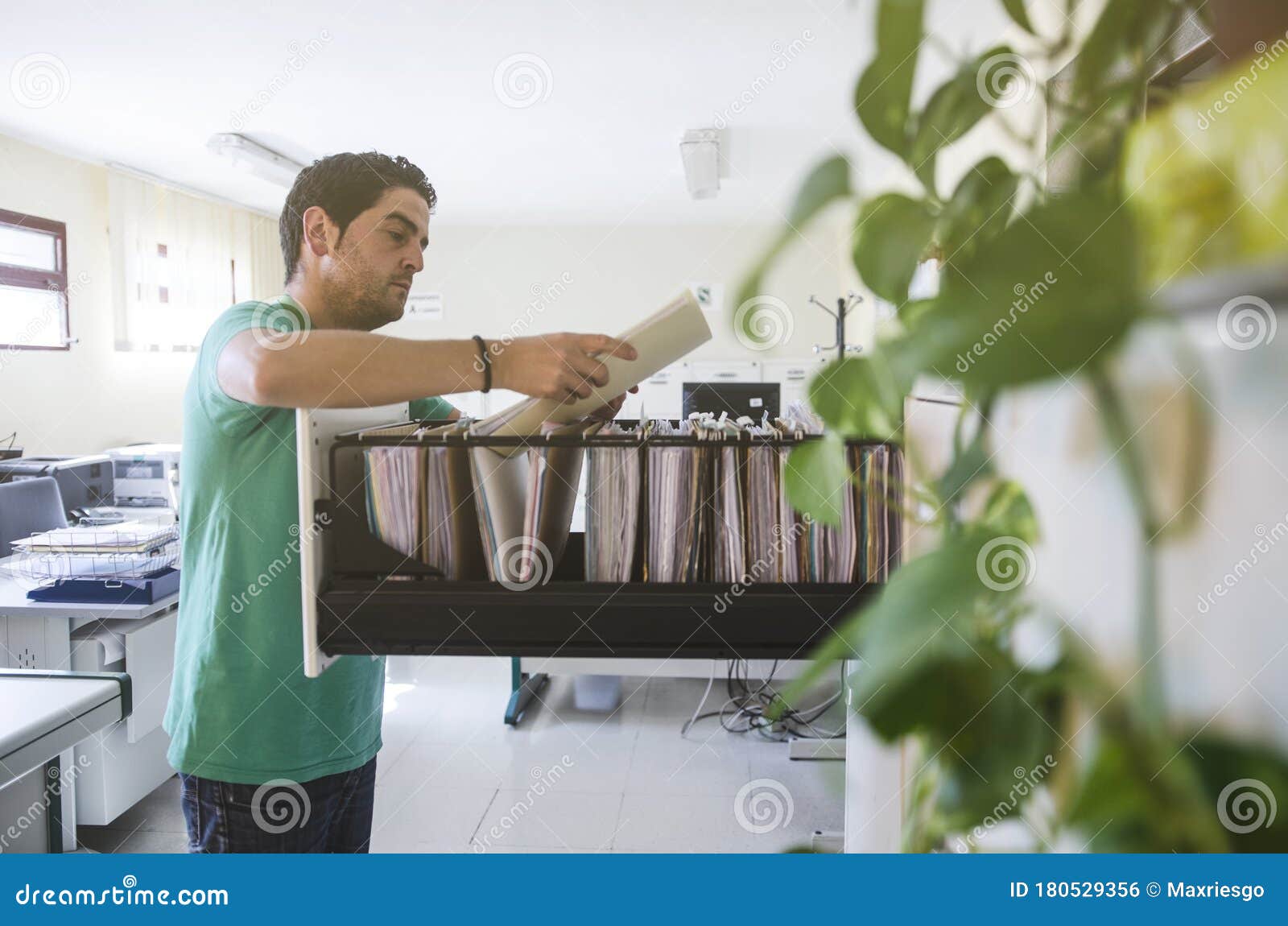 Office Worker in Office Looking in Drawer Files Stock Photo - Image of ...