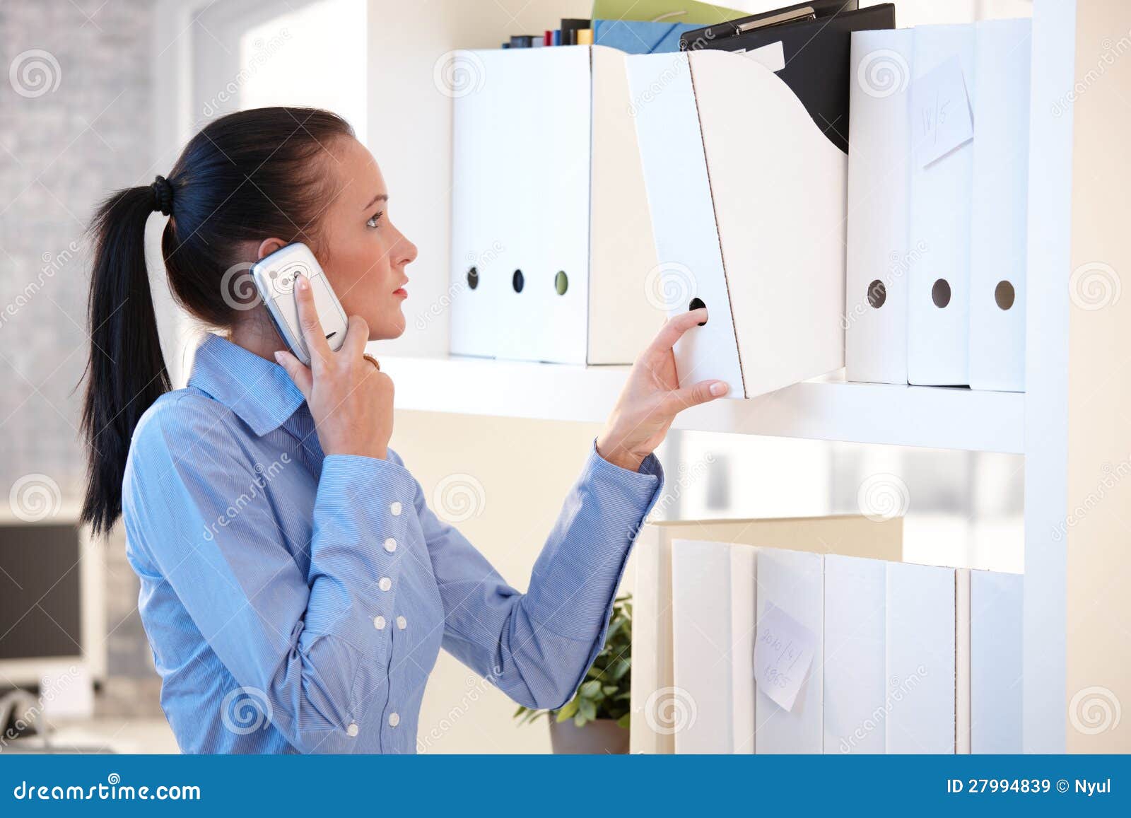 Office Worker on Mobile Phone Choosing File Folder Stock Image - Image ...