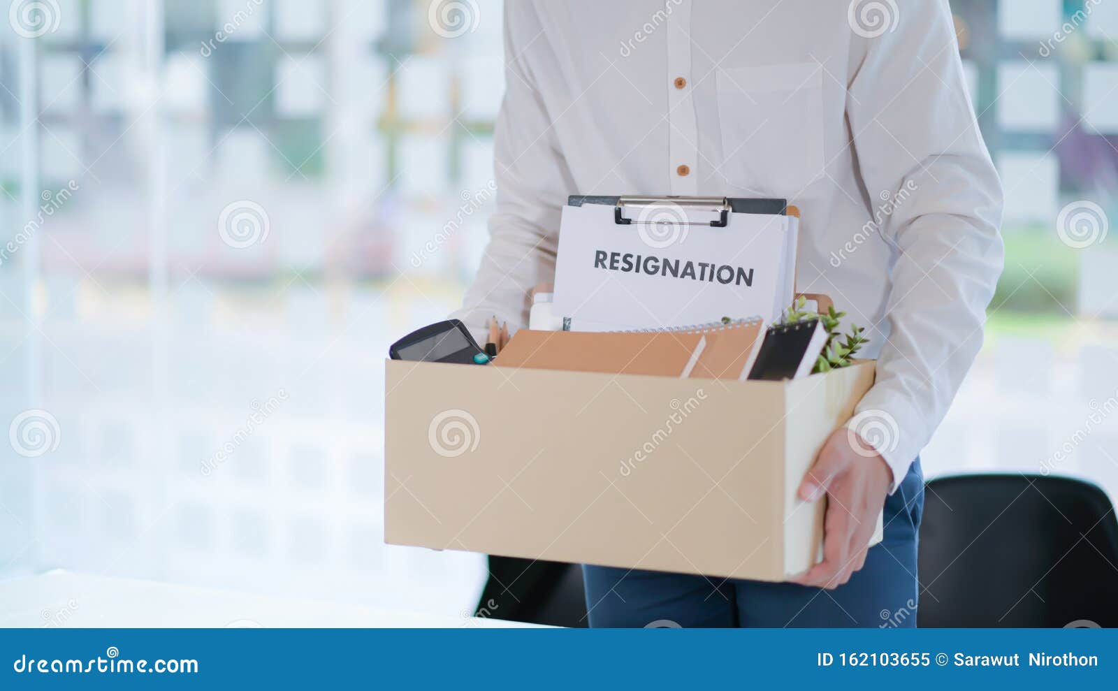 The Office Worker is Packing Things after Resigning from Work Stock ...