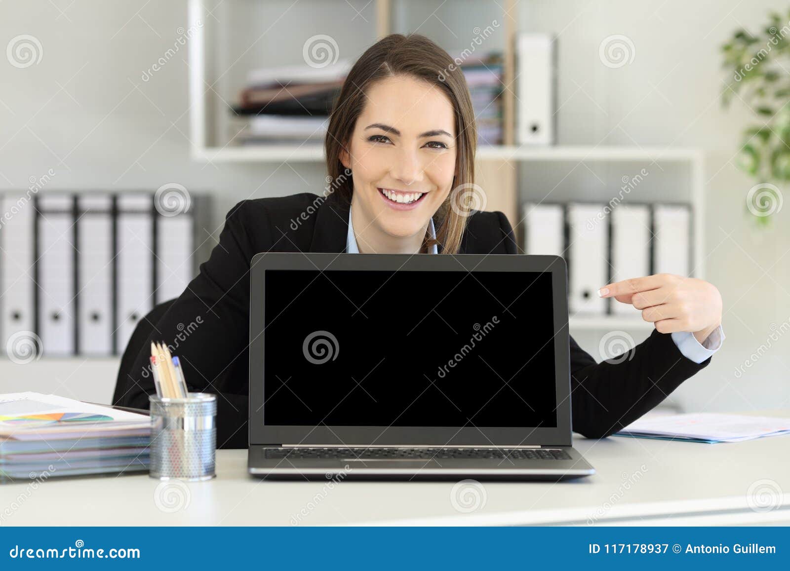 Office Worker Pointing at a Laptop Screen Mockup Stock Image - Image of ...