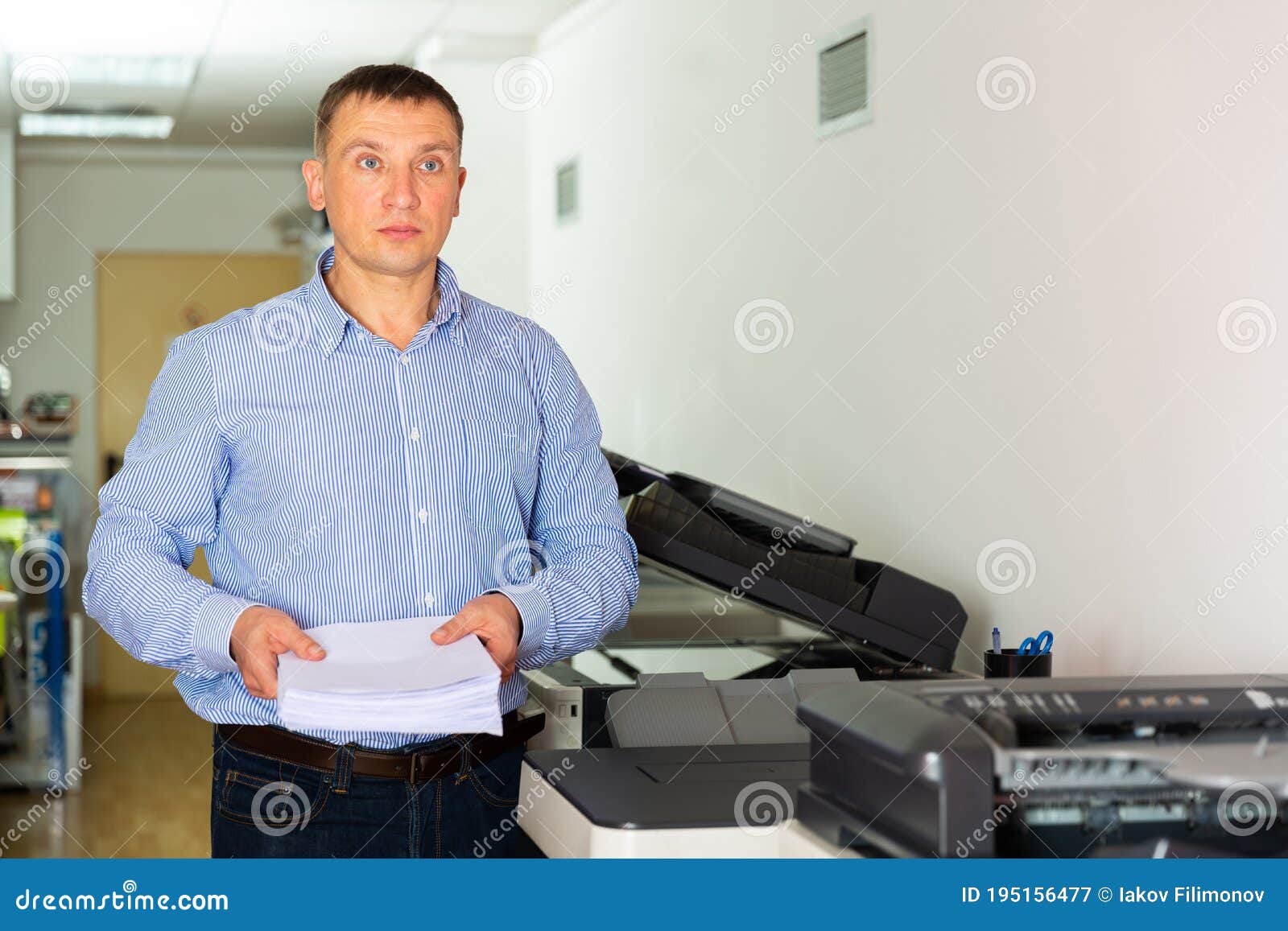 Office Worker Puts a Stack of Paper in the Printer Stock Image - Image ...