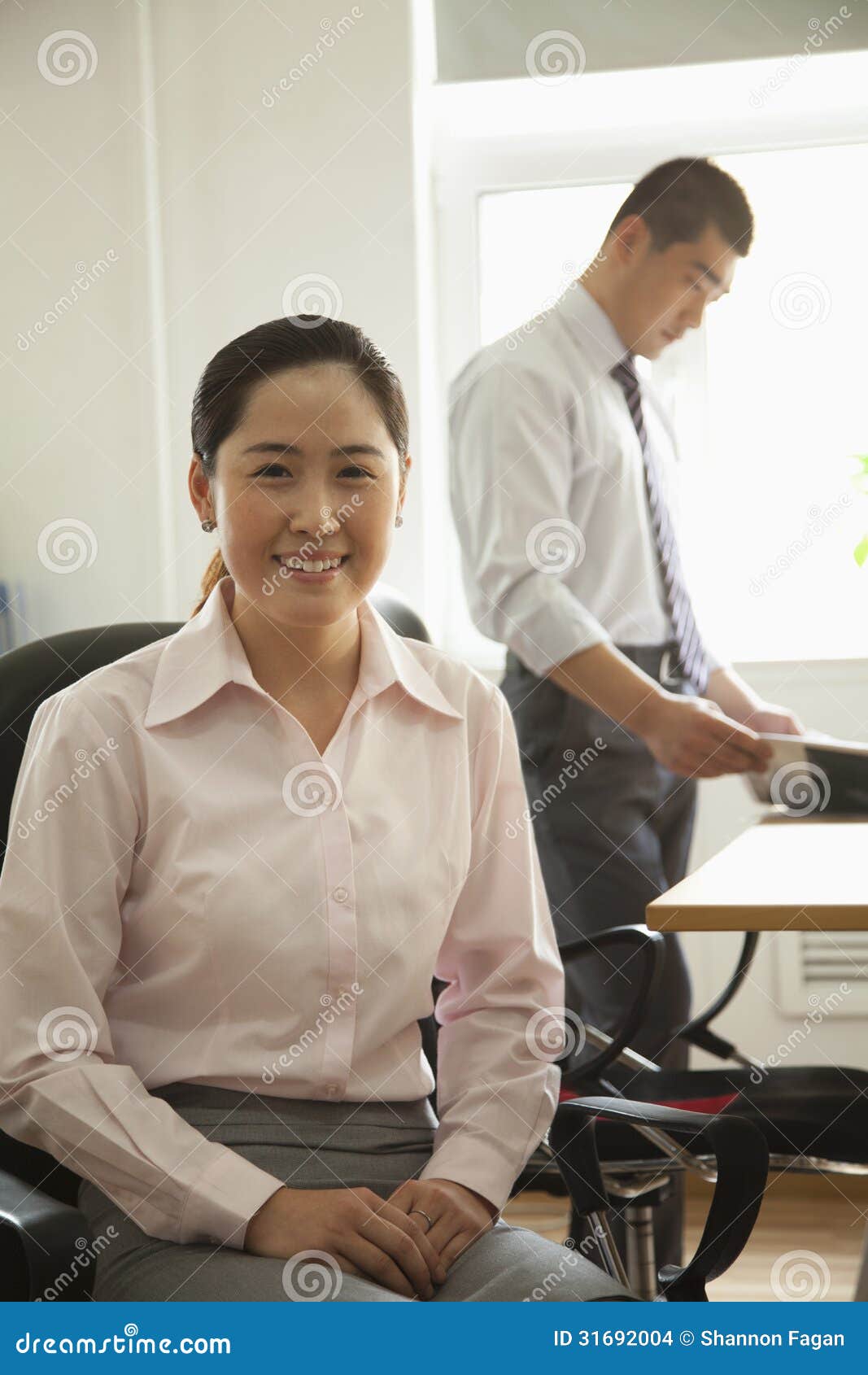Office Worker Seating and Smiling, Portrait Stock Photo - Image of ...