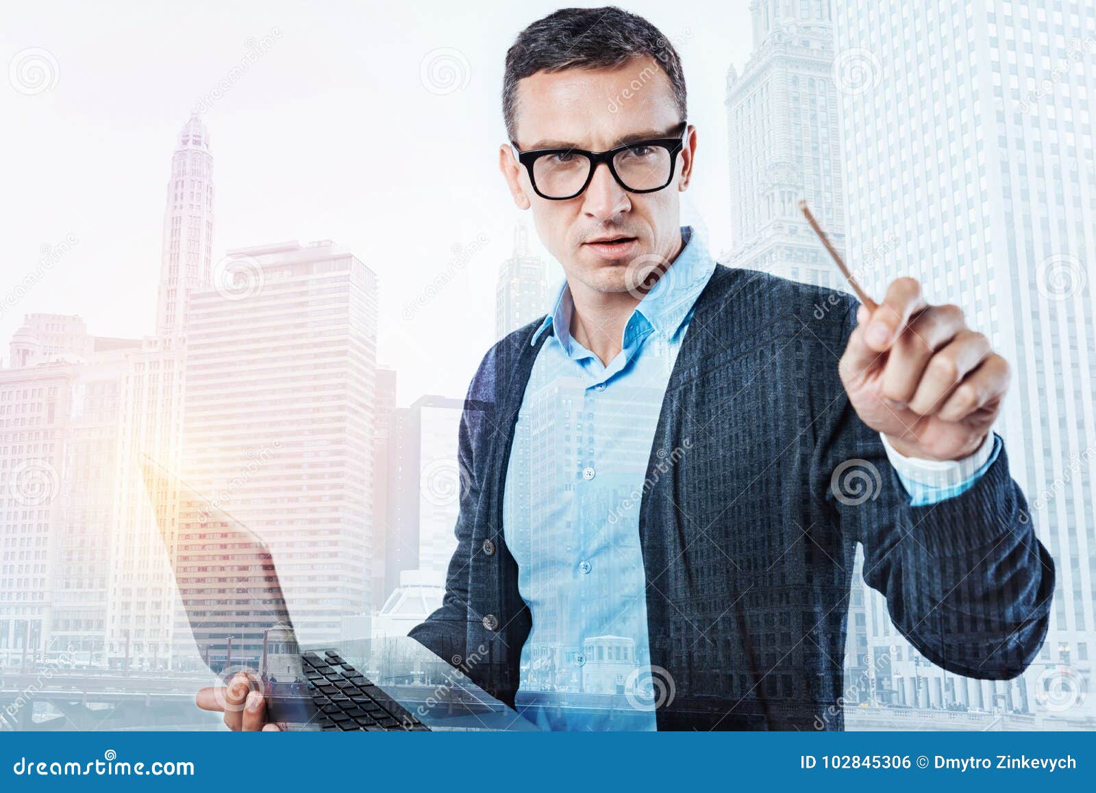 Serious Intelligent Man Holding a Laptop Stock Photo - Image of ...