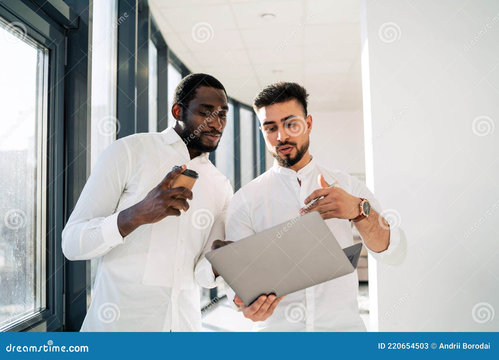 Office Worker Showing His Boss a Report on Laptop. Stock Image - Image ...