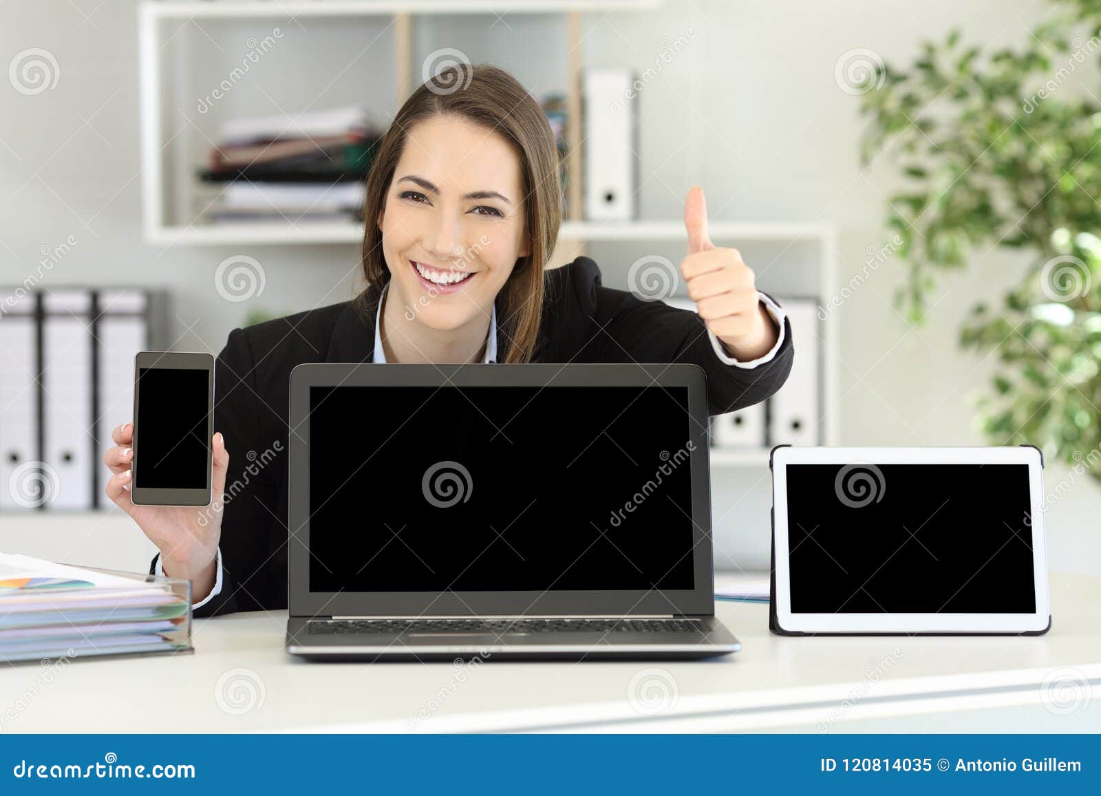 Office Worker Showing Multiple Device Screens Stock Image - Image of ...