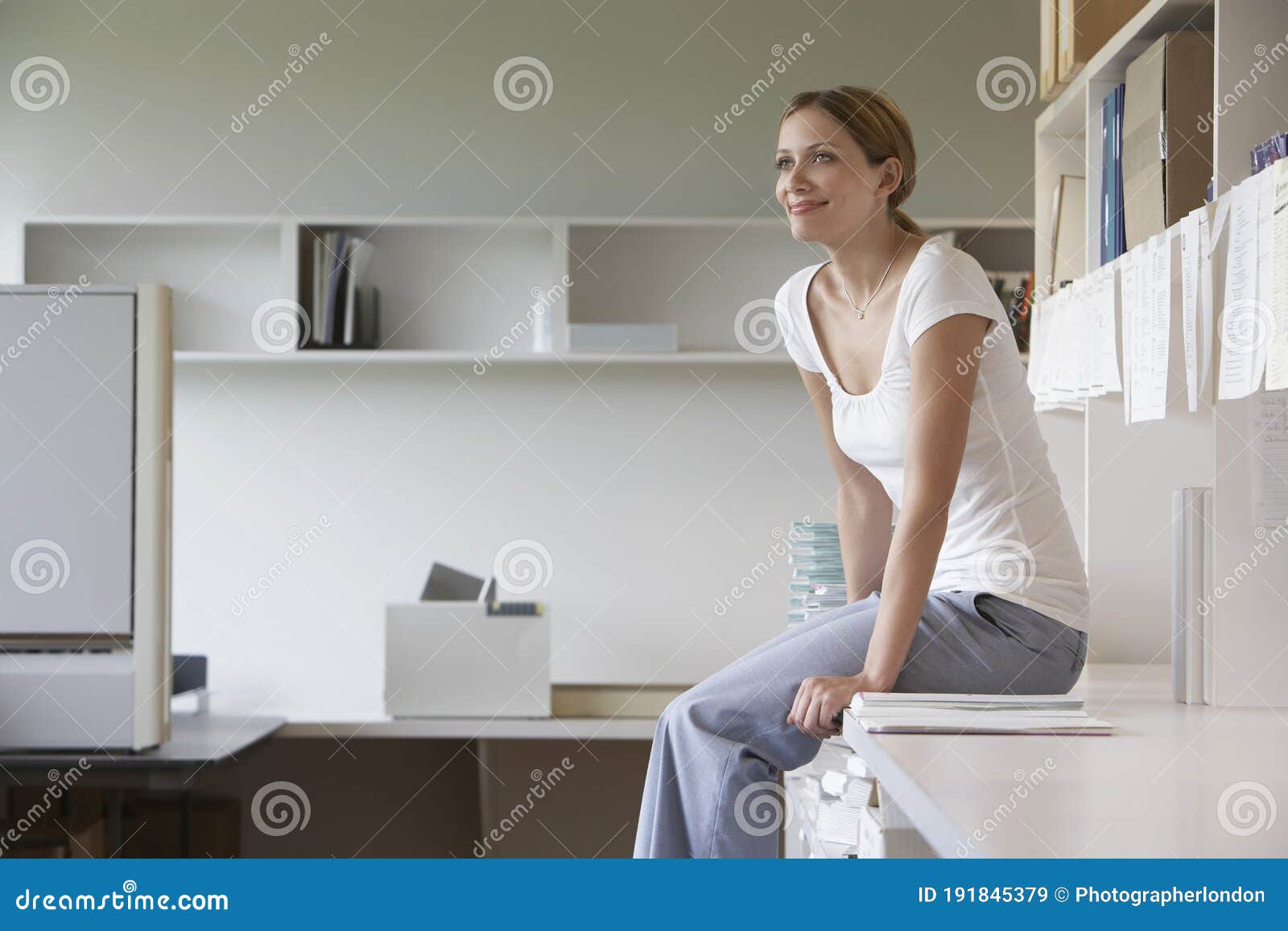 Office Worker Sitting on Bench in Office Side View Stock Image - Image ...