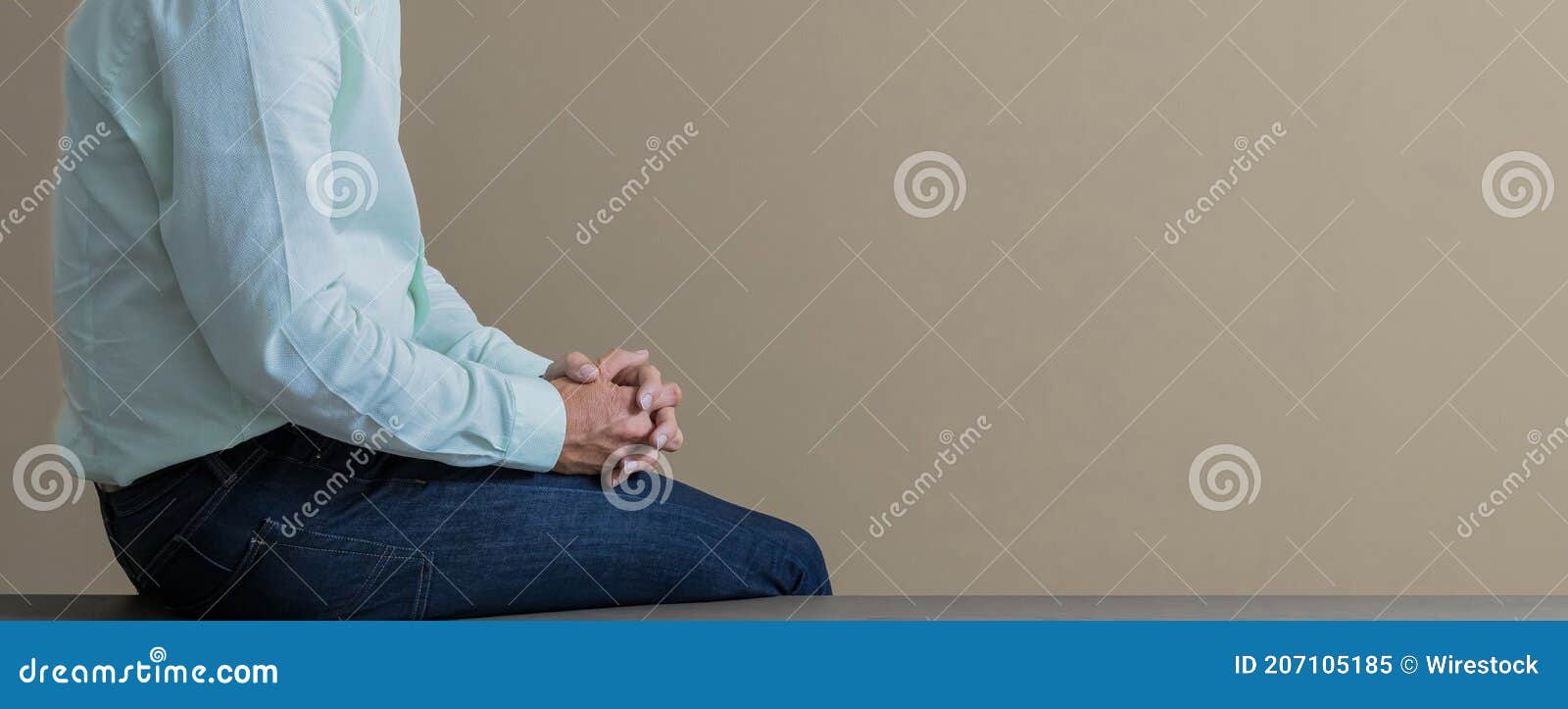 Office Worker Sitting on the Table while Holding His Hands Together ...