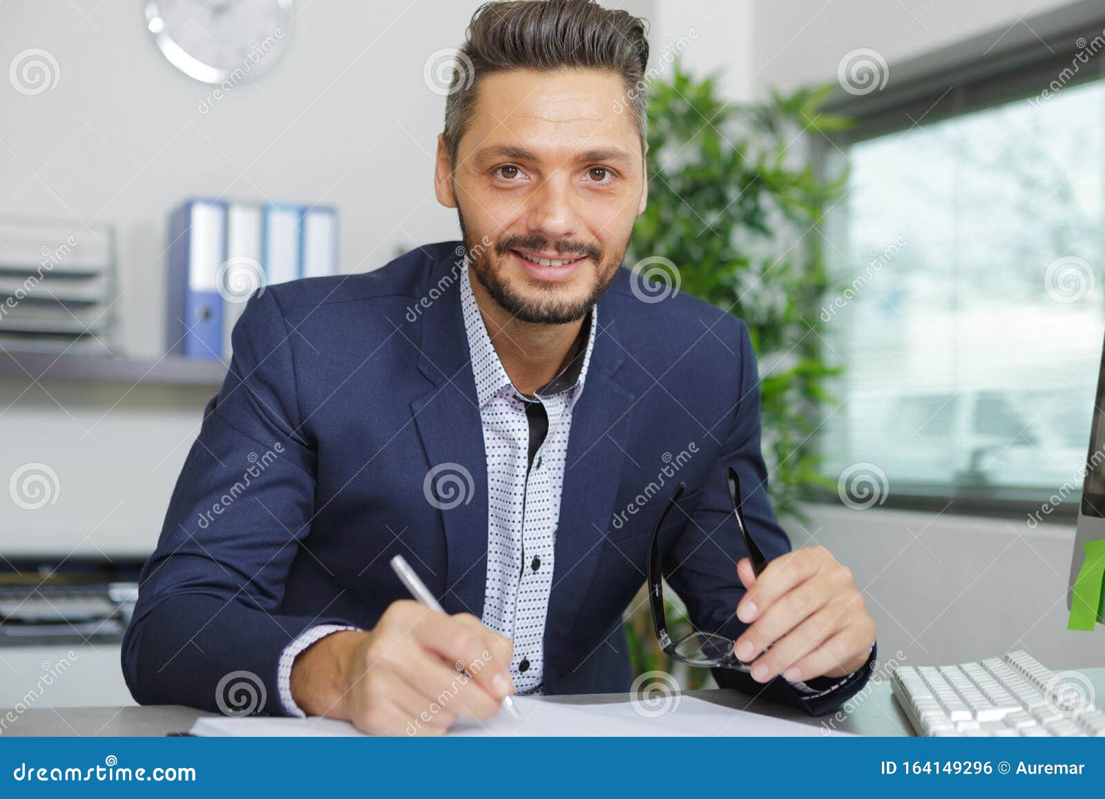 Office Worker Smiling at Camera Stock Photo - Image of computer, male ...