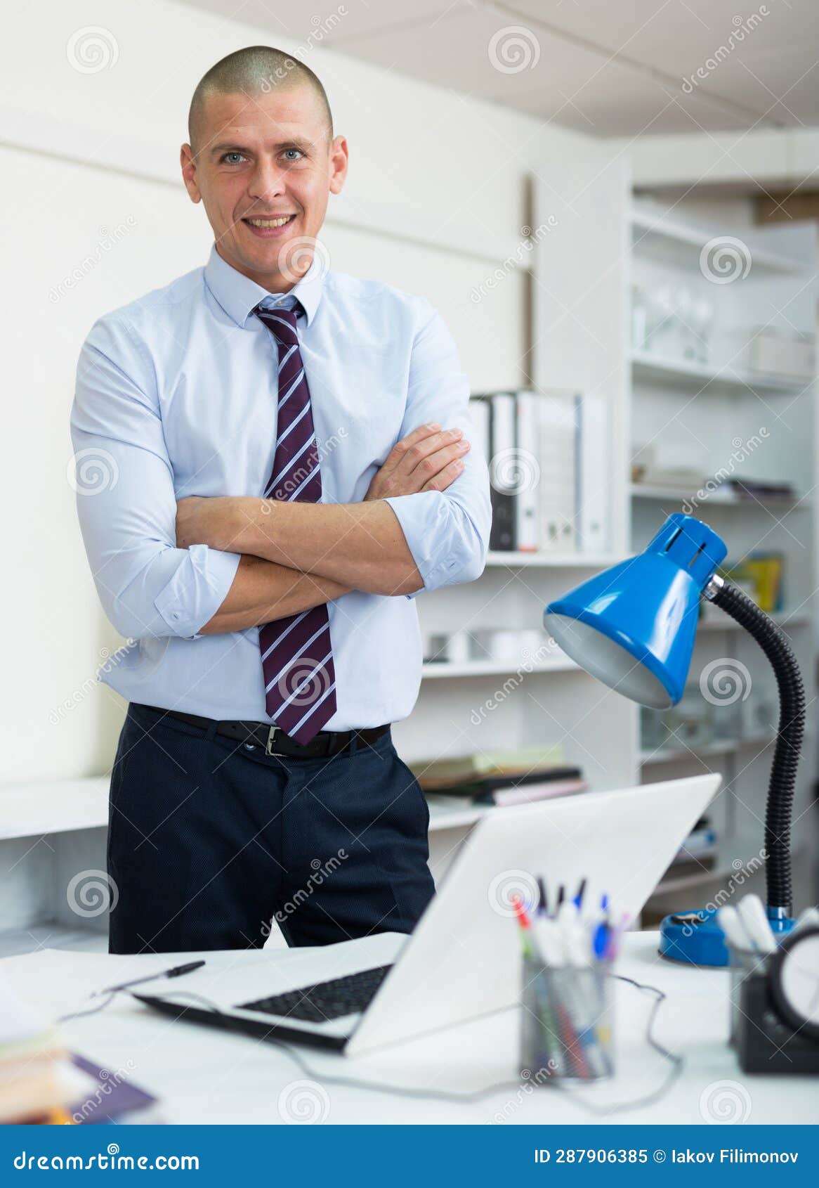 Office Worker Standing in Workplace and Looking in Camera Stock Image ...