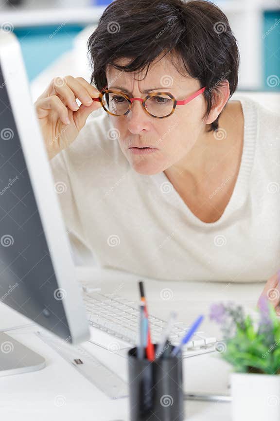 Office Worker Staring at Computer Screen and Adjusting Glasses Stock ...