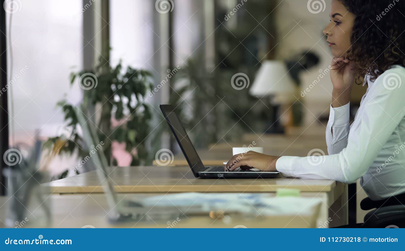 Office Worker Takes Thought at Workplace, Distracted with Personal ...