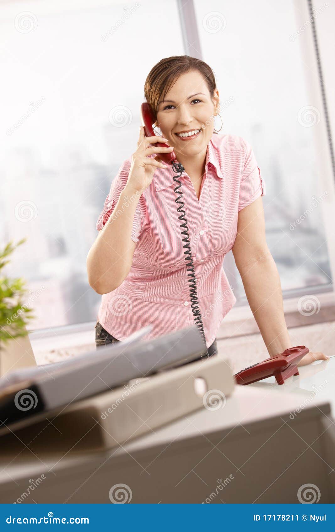 Office Worker Talking on Phone Stock Image - Image of landline, looking ...