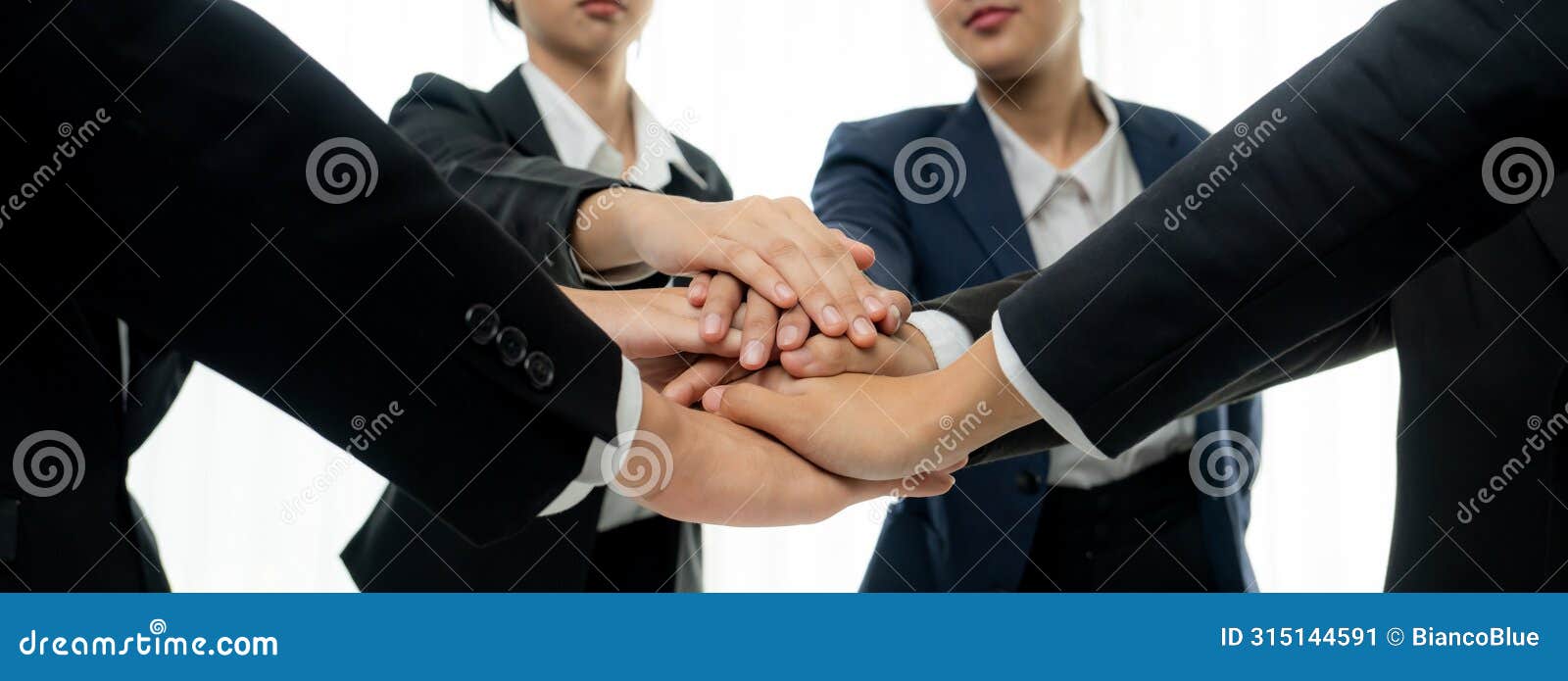 Office Worker Team Stacking Hand Together Symbolize Successful Teamwork ...