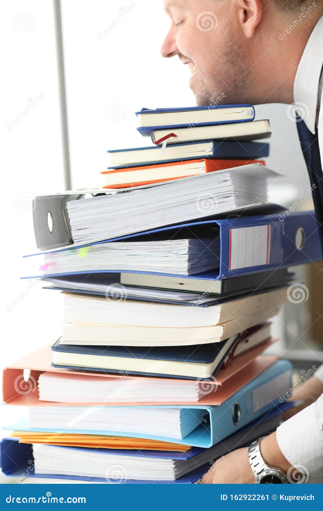 Office Worker Trying To Lift Huge Pile of Documents Stock Image - Image ...