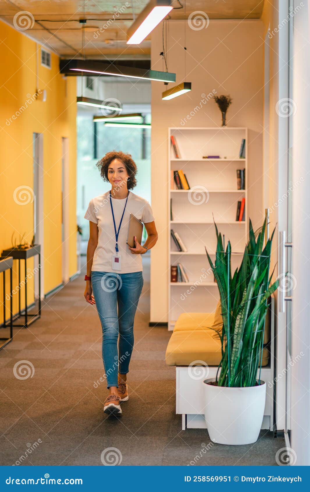 Office Worker Walking in the Office Corridor and Looking Contented ...