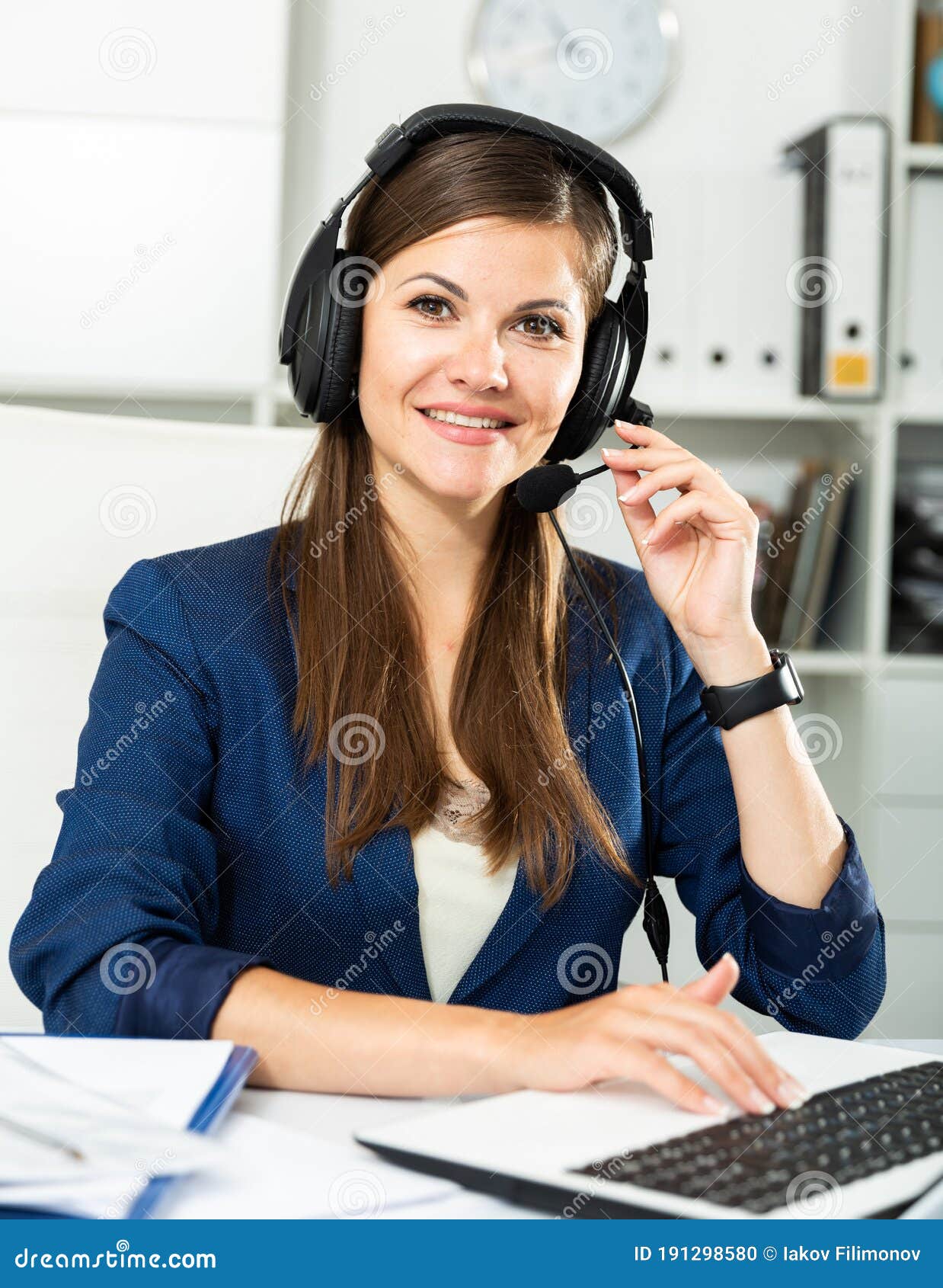 Office Worker Woman is Working at a Computer and Talking by Headset ...