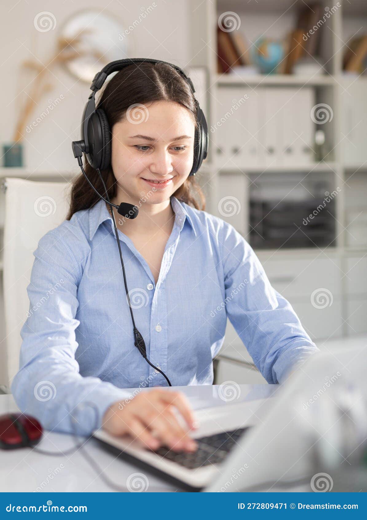 Office Worker Woman is Working at a Computer and Talking by Headset ...