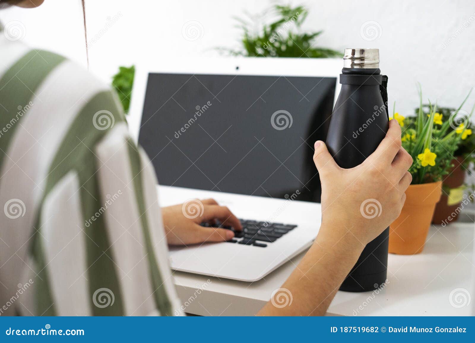 Office Worker at Work with a Thermos. Drinking Water at Work. Hydration ...