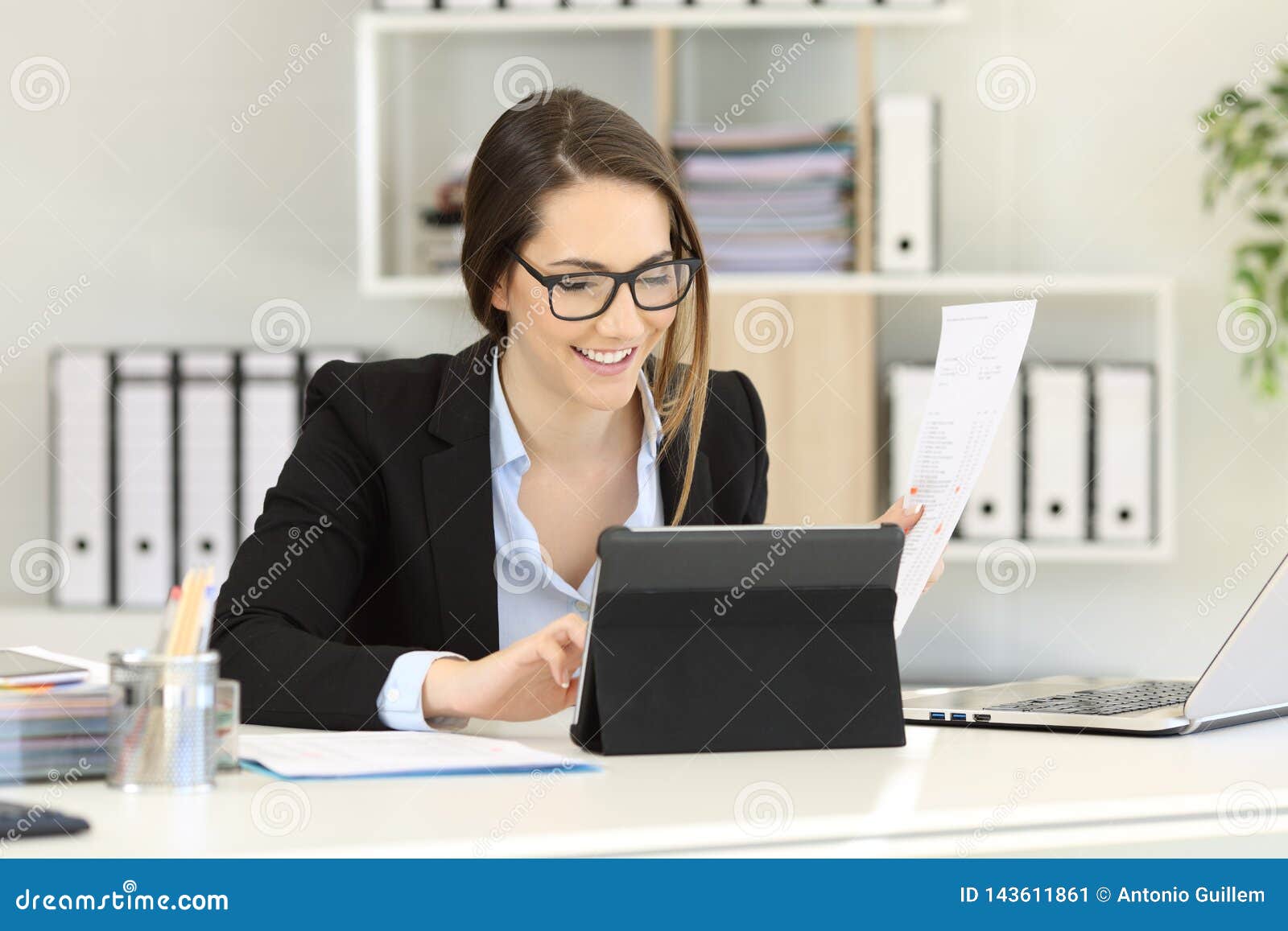 Office Worker Working Comparing Documents on Tablet Stock Image - Image ...