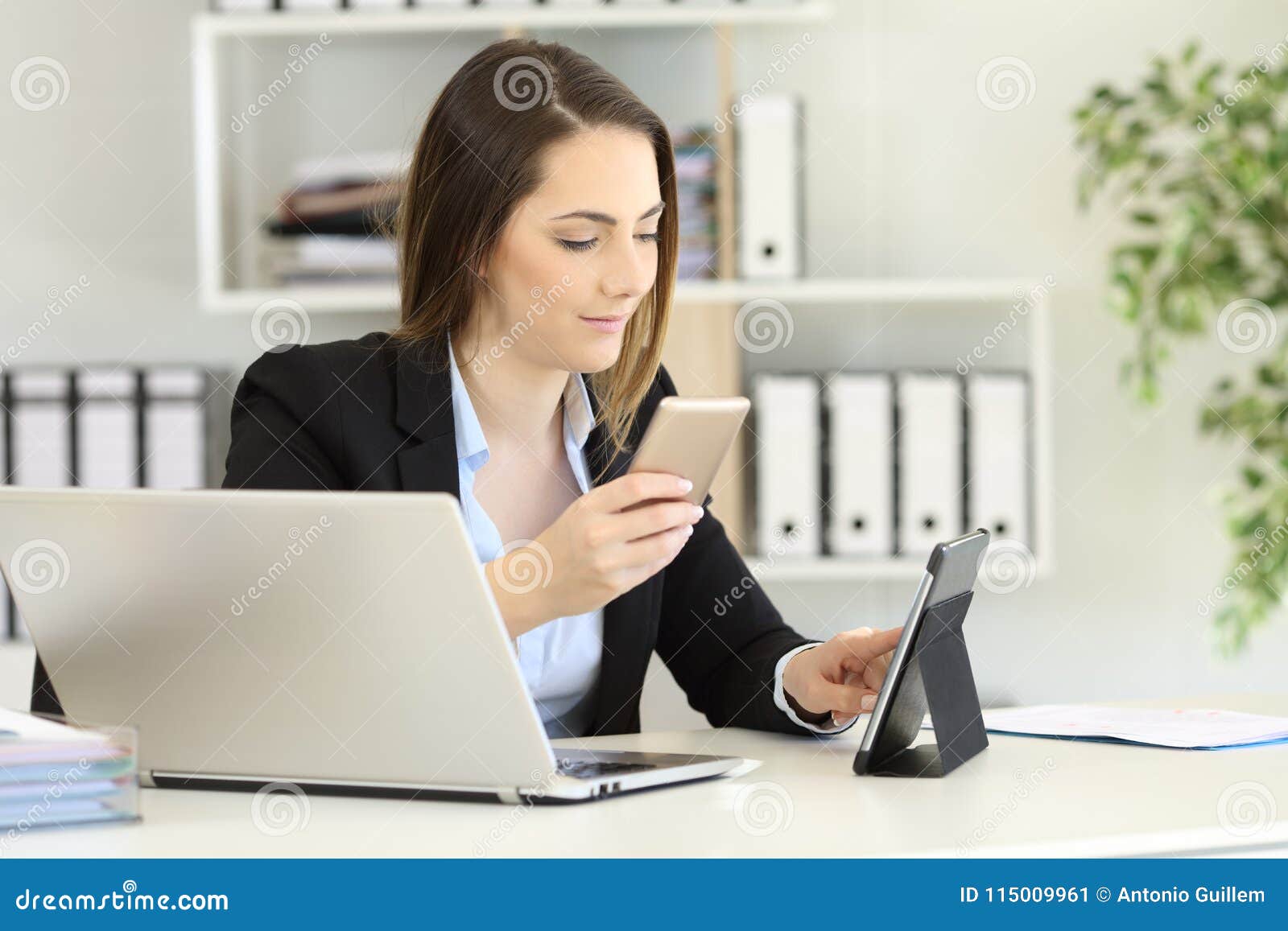 Office Worker Working with Multiple Devices Stock Image - Image of ...