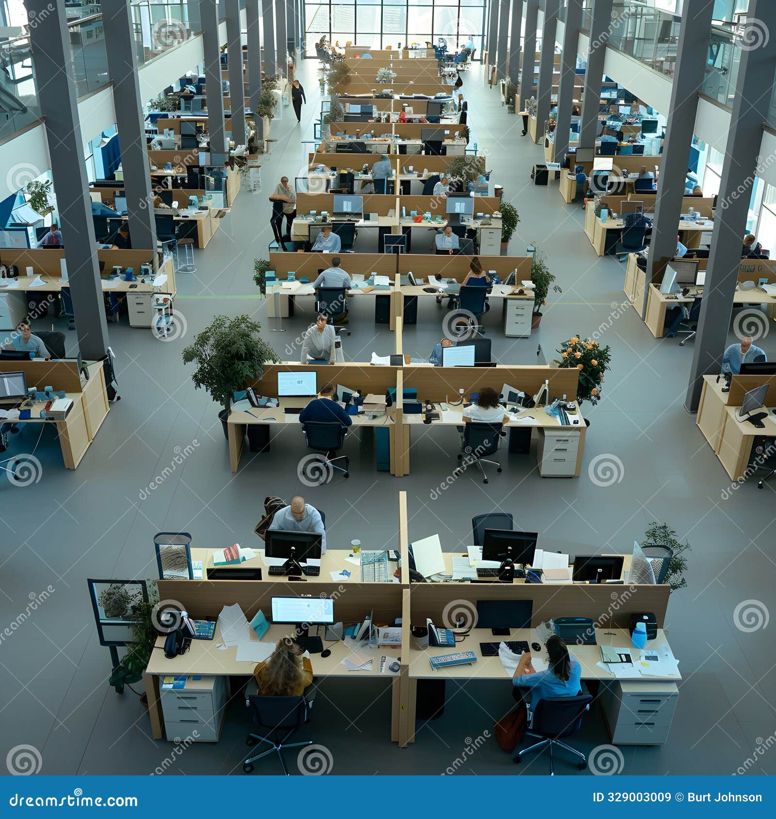 Office Workers Concentrating at Their Desks in a Large Open Plan Office ...