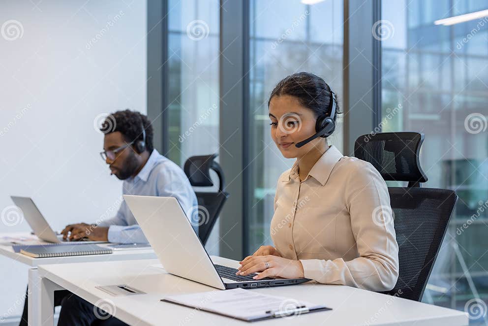 Customer Service Professionals Working with Laptops in a Modern Office ...