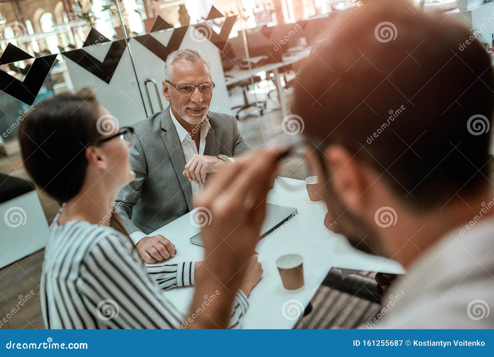 Office Workers. Group of Business People Discussing Something while ...