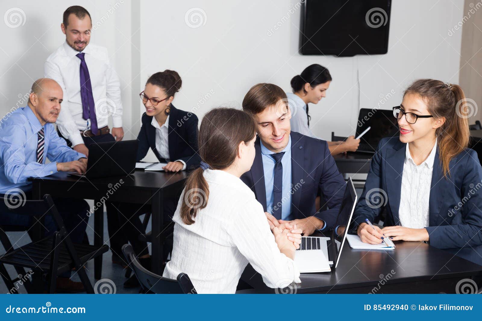 Office Workers with Laptops Having a Productive Day at Work Stock Photo ...