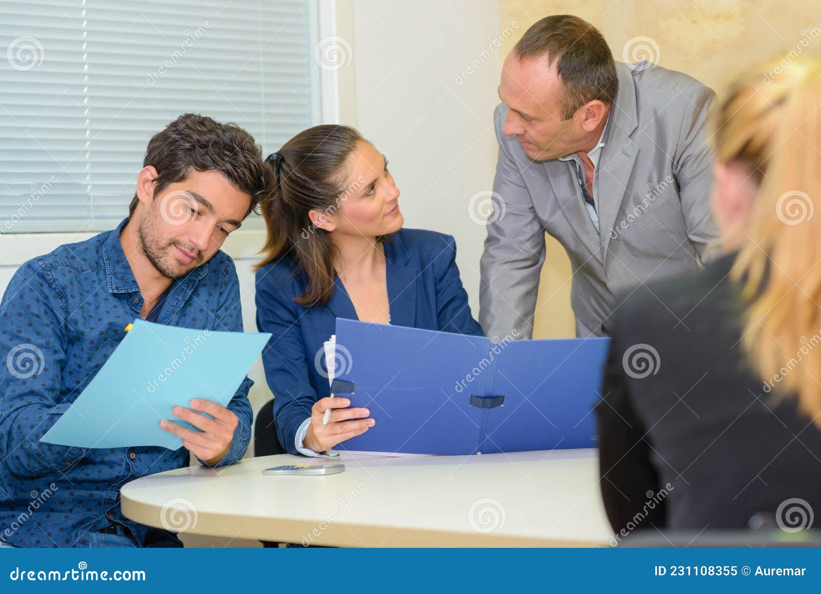 Office Workers Looking at Files Stock Image - Image of smile, female ...
