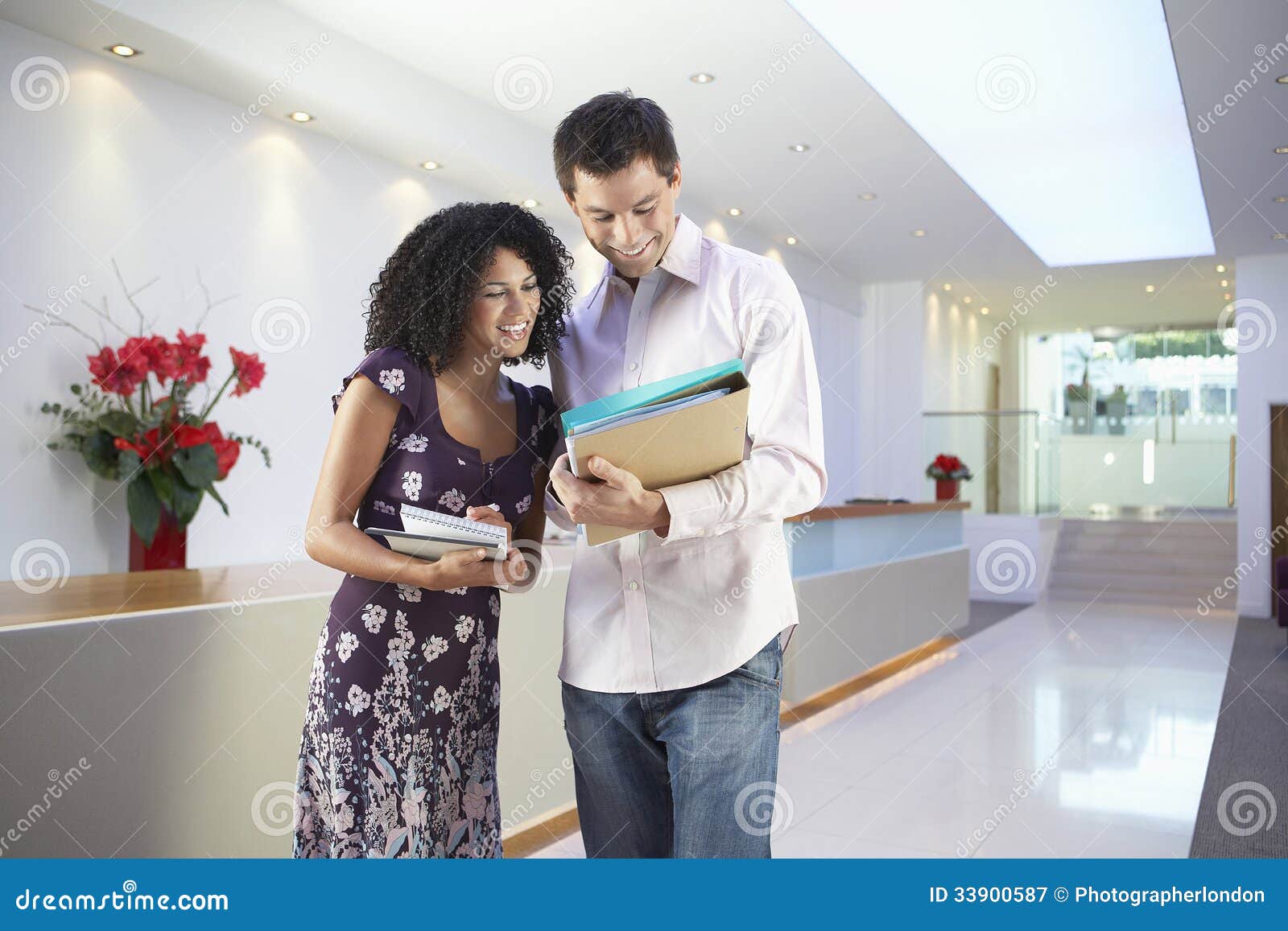 Office Workers Looking Over Paperwork Stock Image - Image of ...