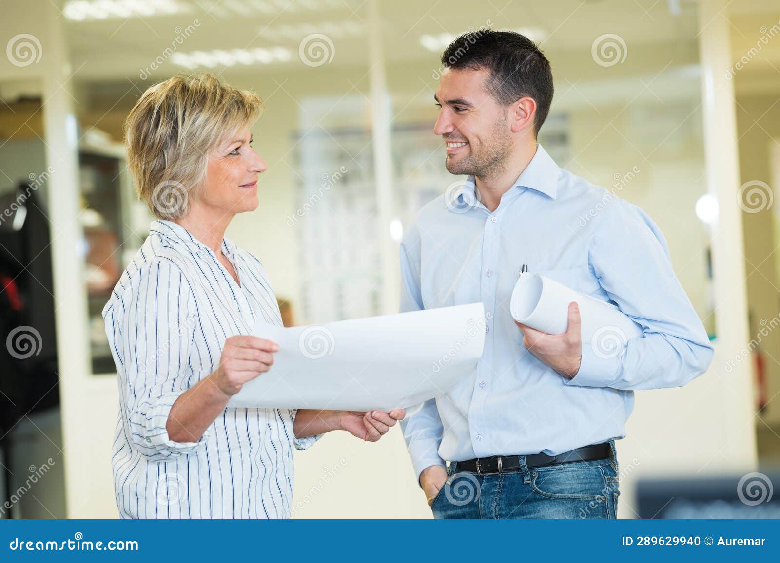 Office Workers Looking at Paperwork Stock Photo - Image of togetherness ...