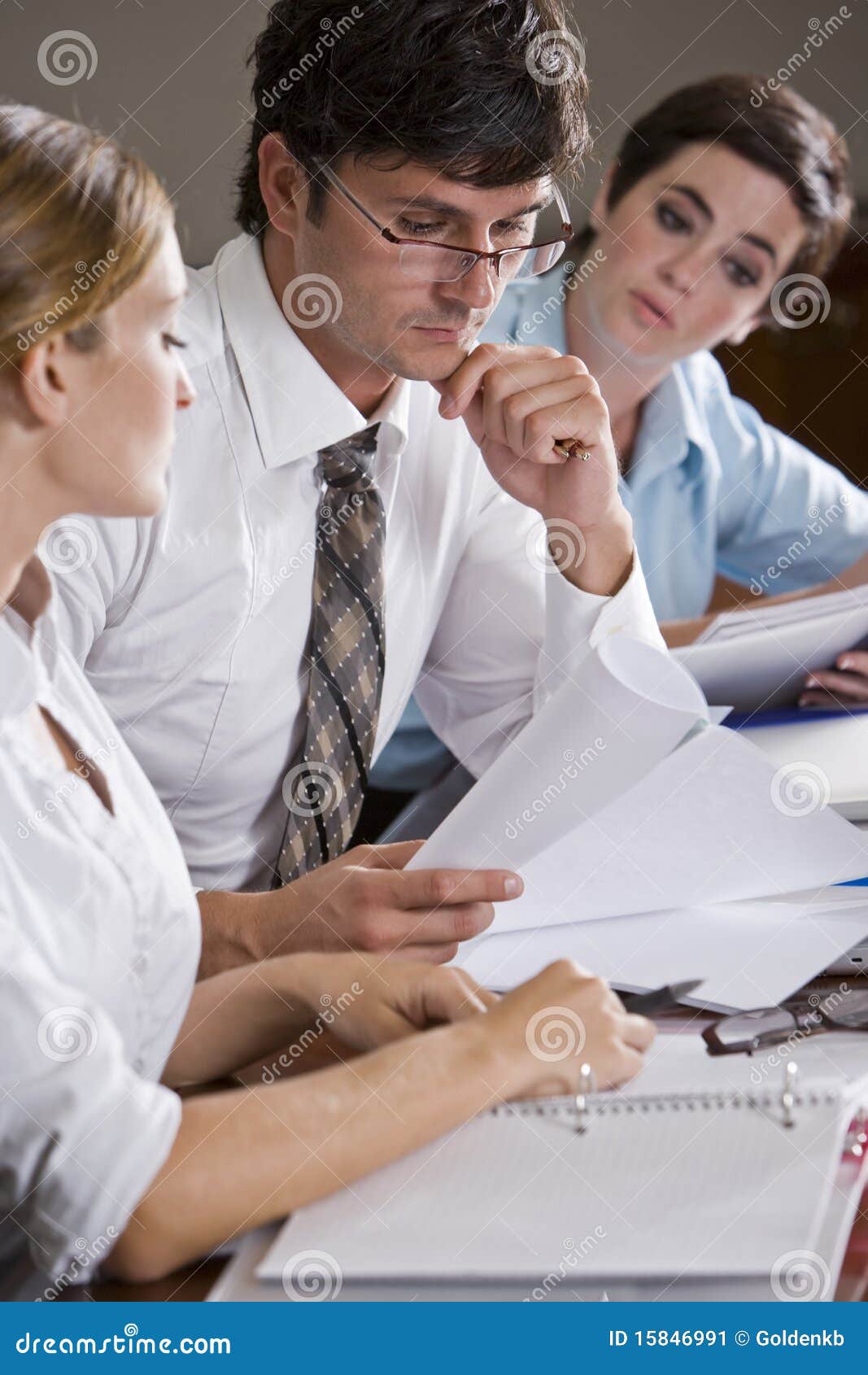 Office Workers Reviewing Reports Stock Image - Image of businessman ...