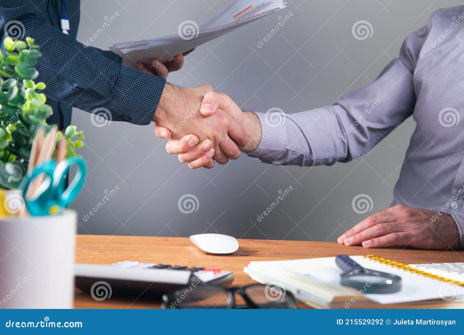 Office Workers Shaking Hands at the Desktop Stock Photo - Image of ...