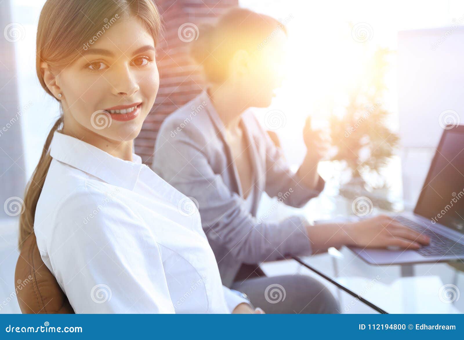 Office Workers Sitting Behind a Desk. Stock Photo - Image of beautiful ...