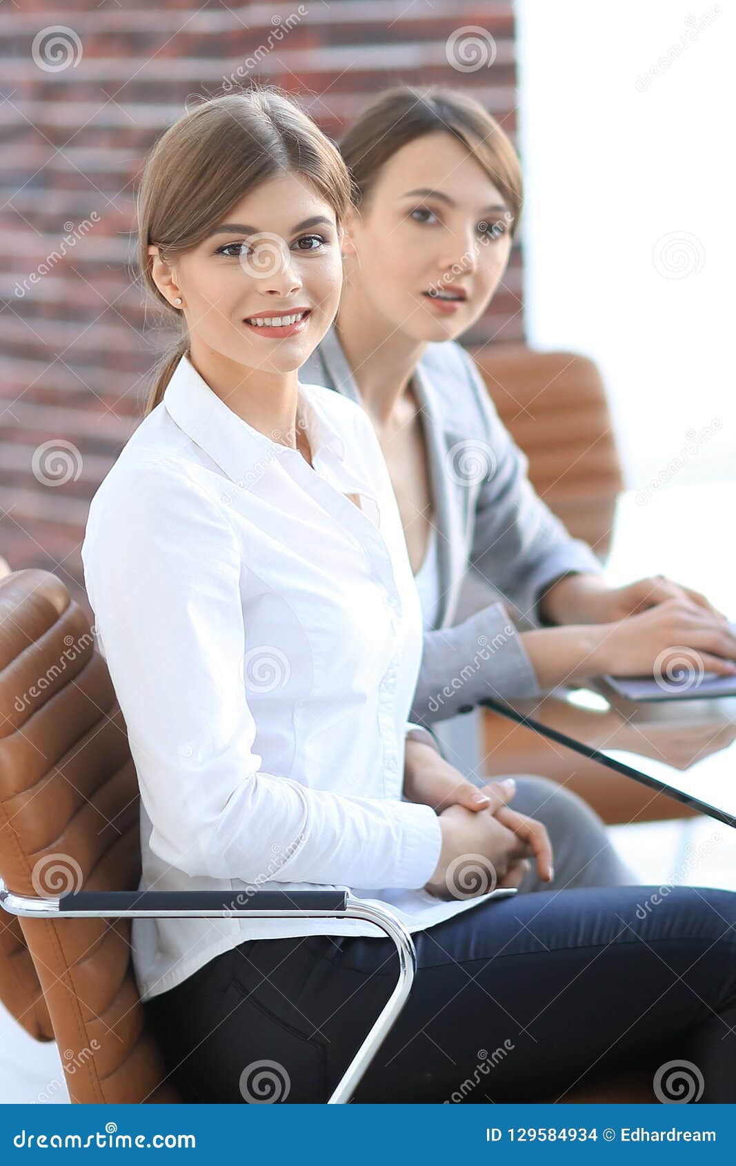 Office Workers Sitting Behind a Desk. Stock Photo - Image of desk ...