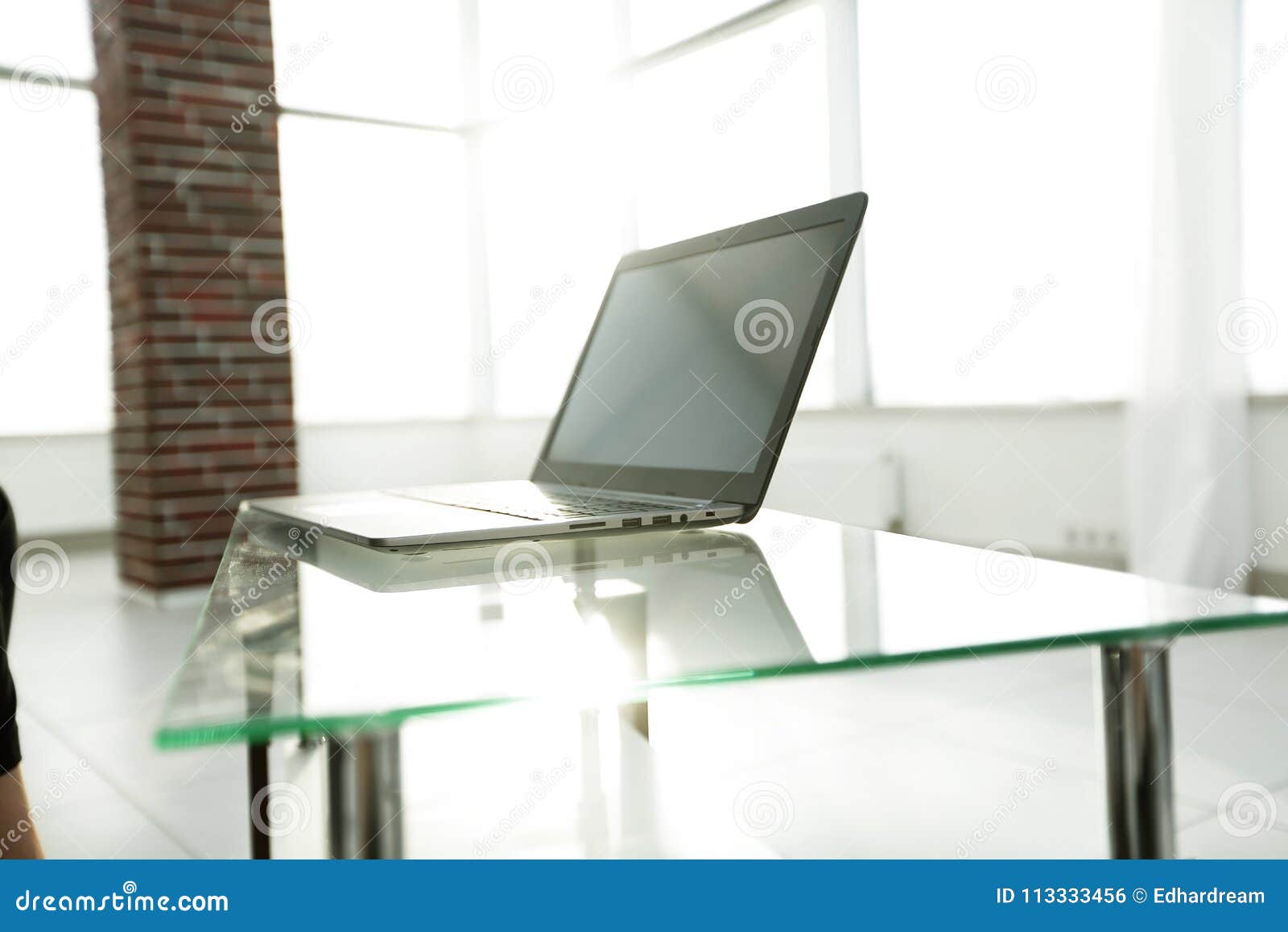 Office Workplace with Laptop on a Glass Table in a Modern Office Stock ...