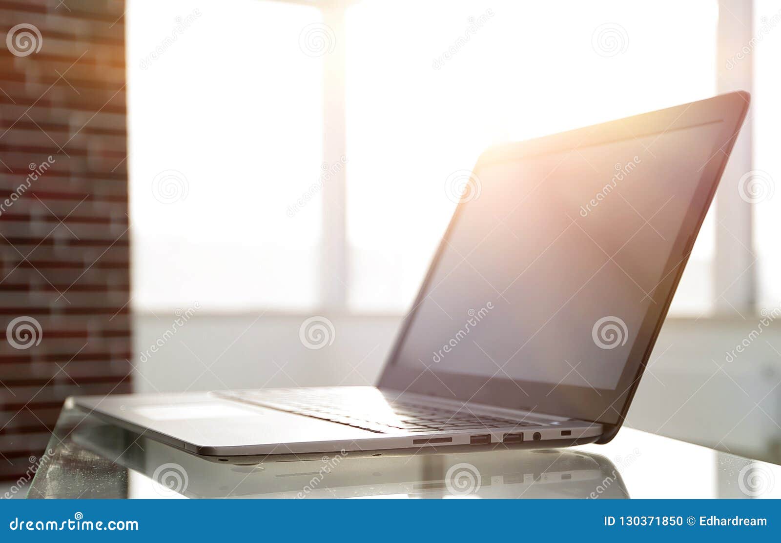 Office Workplace with Laptop on a Glass Table in a Modern Office Stock ...