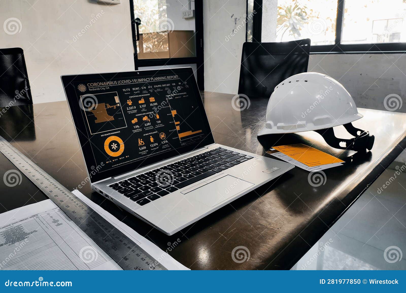 Office Workplace with a Laptop, Notes, and a Hard Hat on a Conference ...