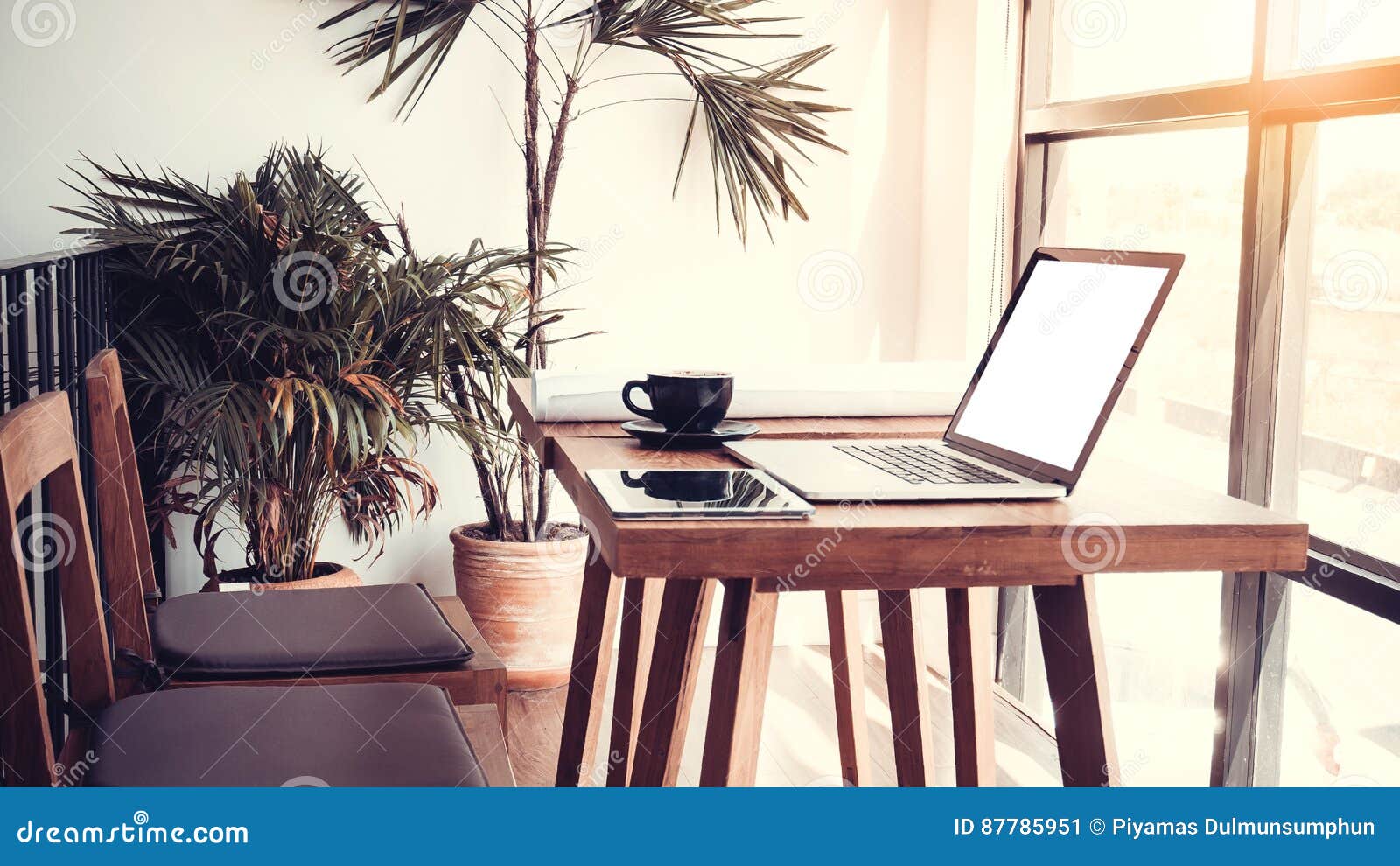Office Workplace with Laptop on Wood Table Against the Windows Stock ...