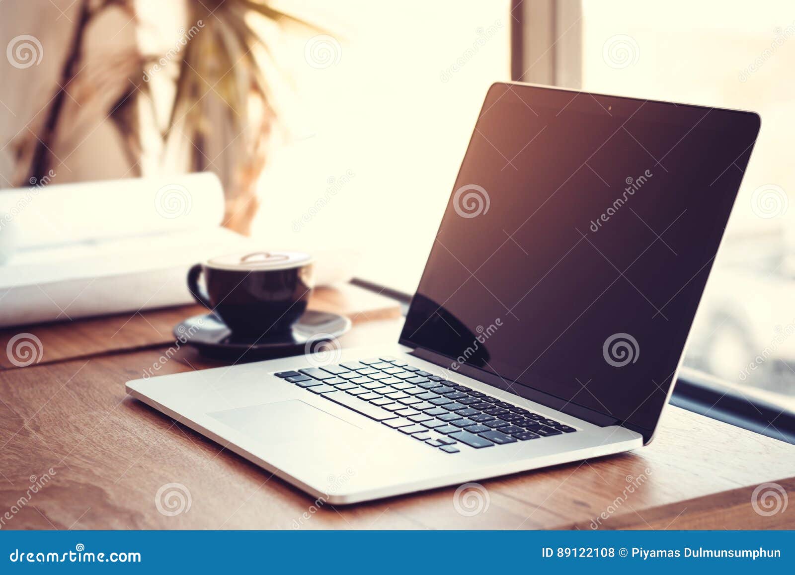 Office Workplace with Laptop on Wood Table Against the Windows. Stock ...