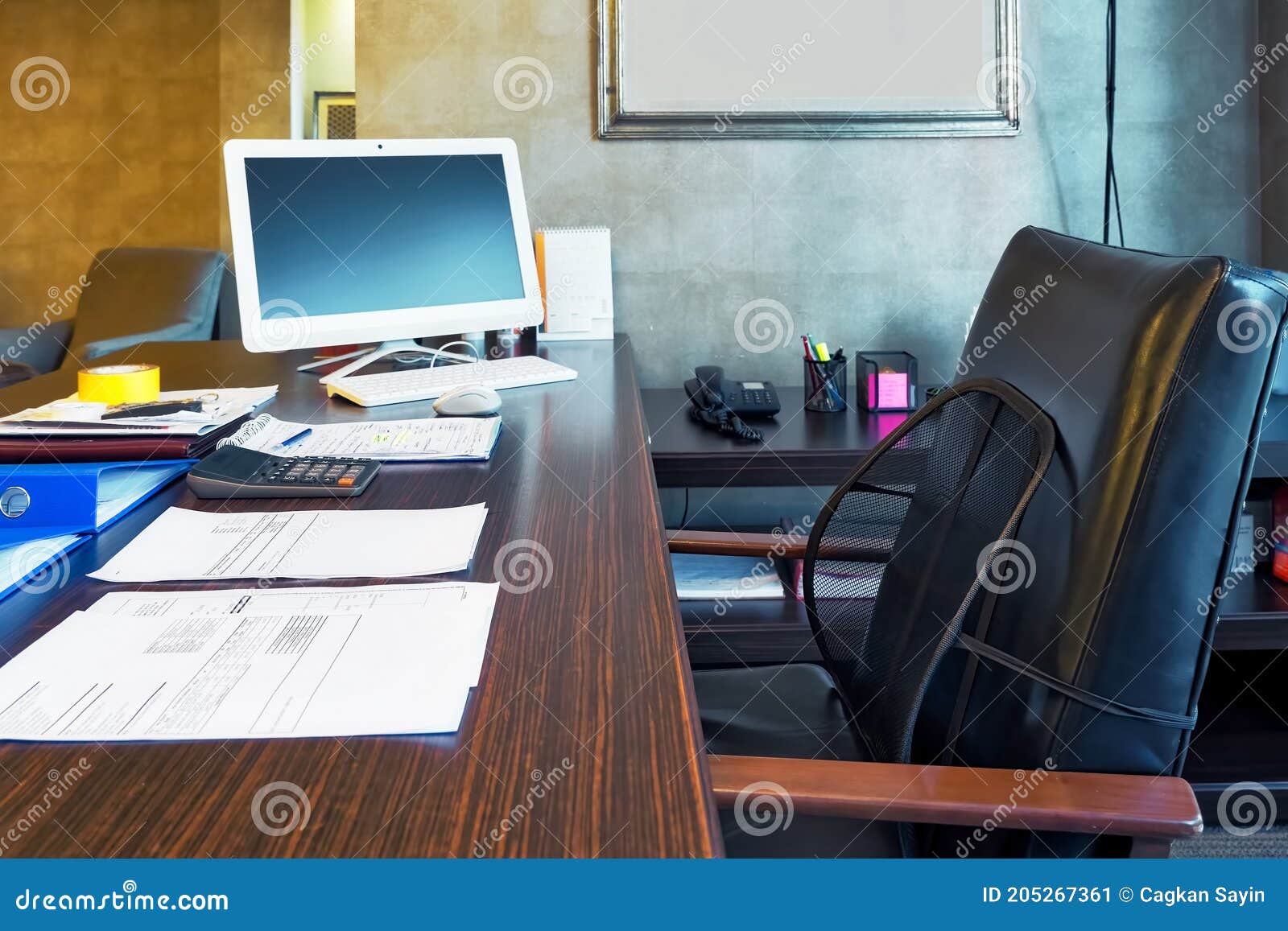 Office Workspace with Desk, Chair, Documents, Calculator and a Computer ...