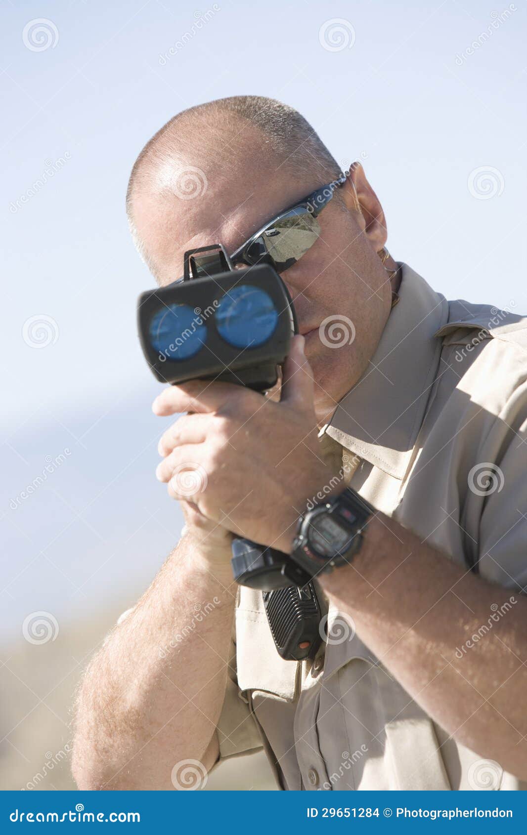 Officer Looking through Radar Gun Stock Photo - Image of sunlight ...