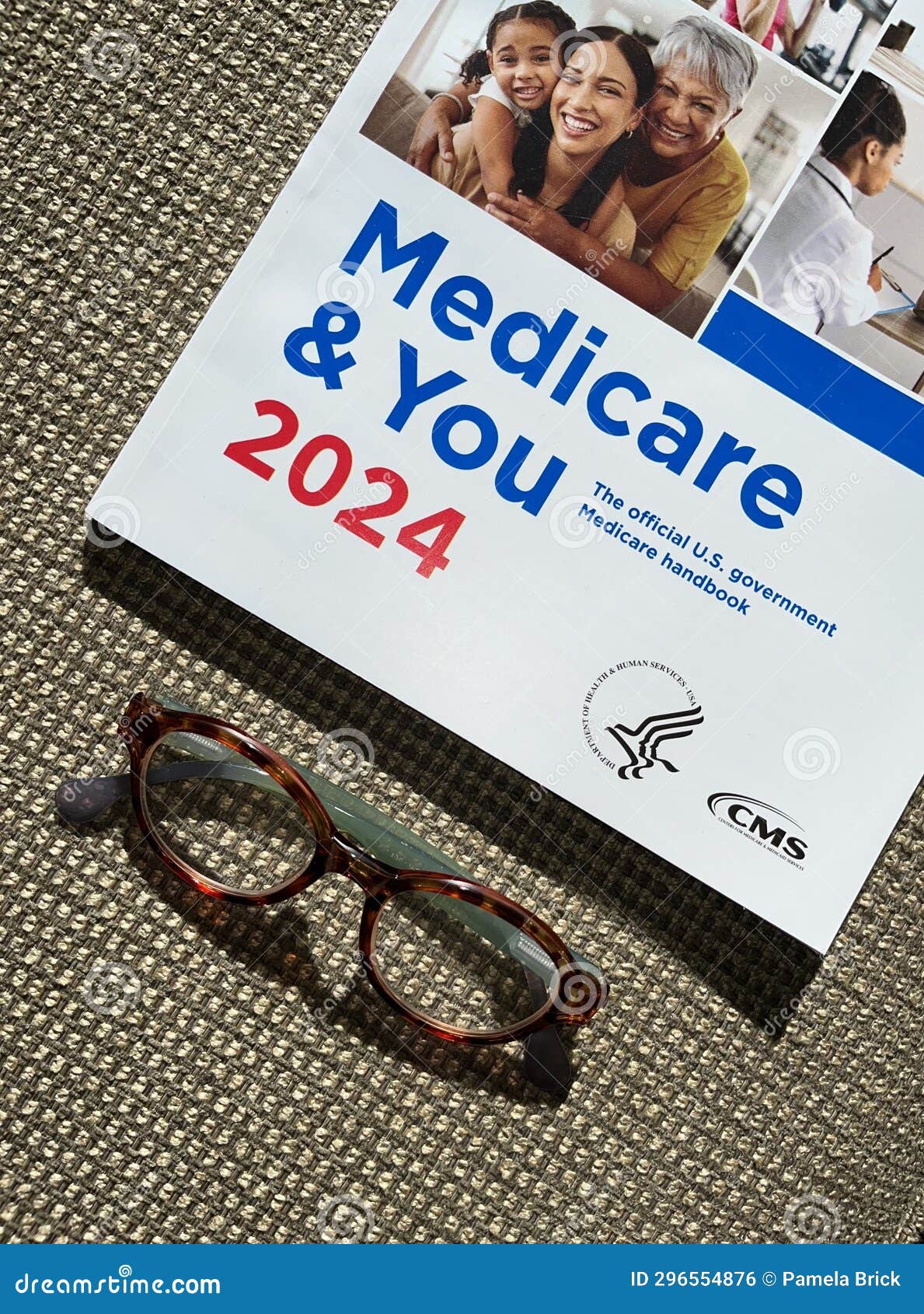 Closeup, 2024 Medicare and You Handbook for Medicare Recipients with a Pair of Glasses Editorial ...