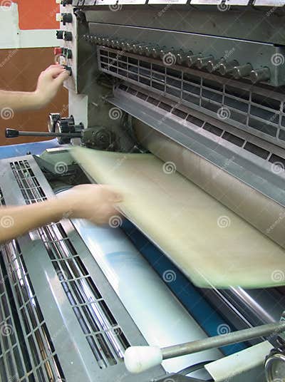 Offset machine working stock photo. Image of printmaster - 4968954