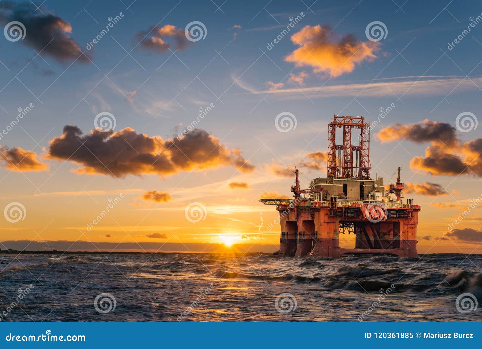 Offshore oil rig at sunset stock image. Image of platform - 120361885