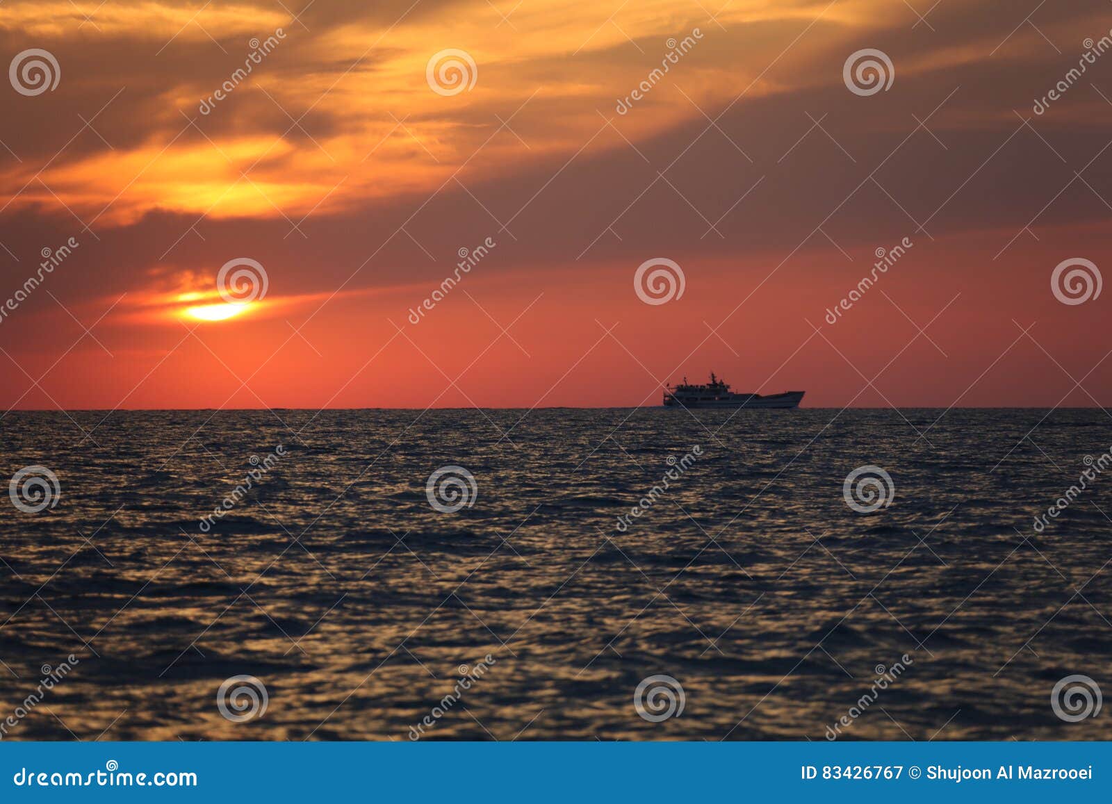 Offshore sunset stock image. Image of ship, sets, passing - 83426767