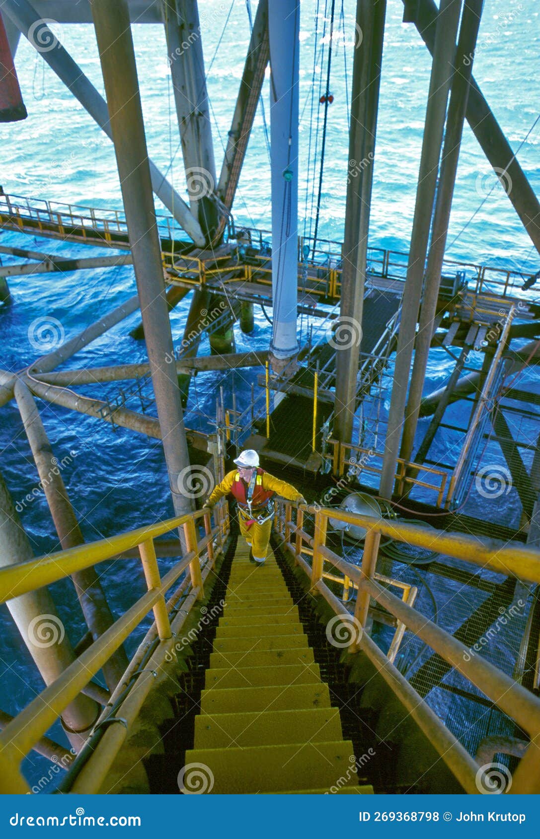 Offshore Worker on the Steps Up from the Sea Deck. Stock Photo - Image ...