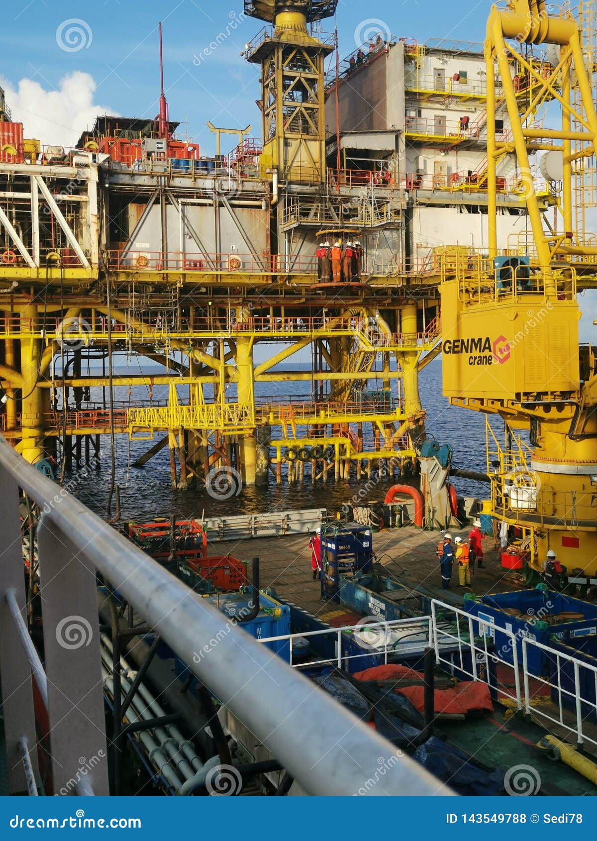 An Offshore Oil Rig Worker Wearing Personal Protective Equipment And ...