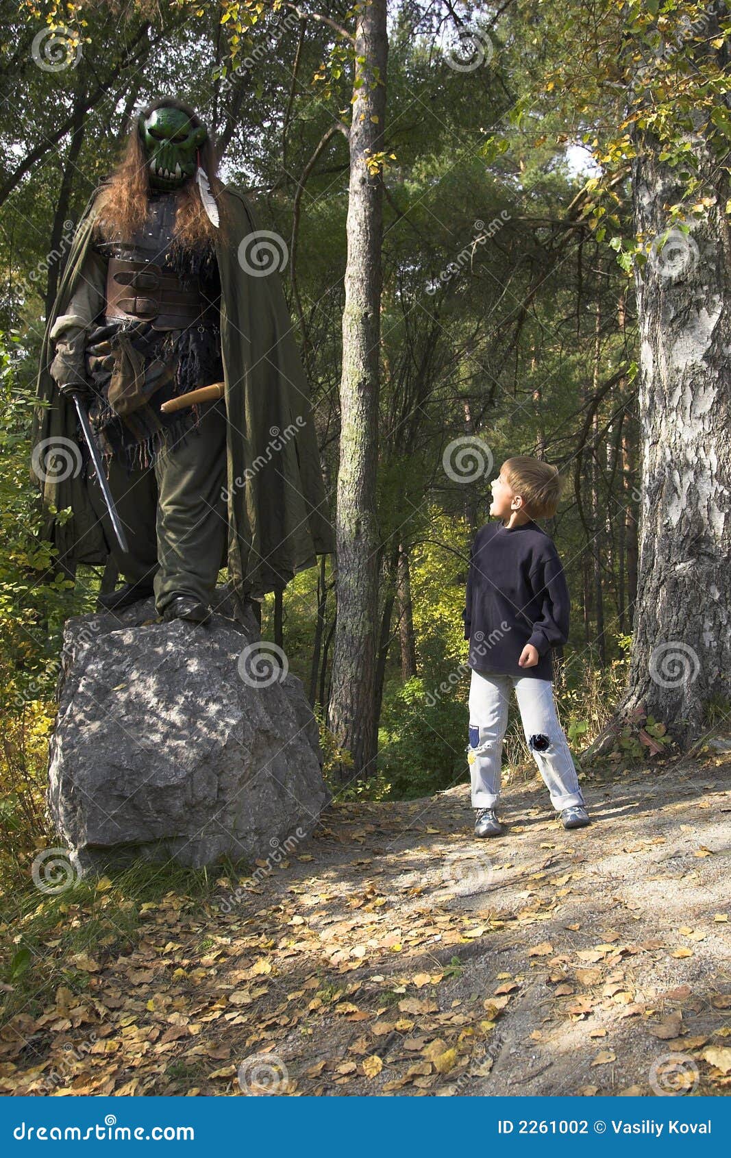 Ogre and boy in the forest stock photo. Image of looking - 2261002